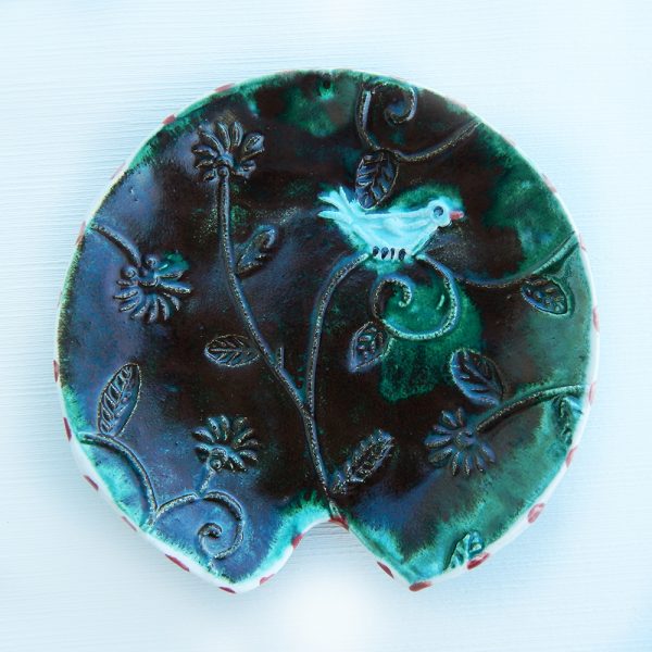 spoon rests are each handmade and painted by artist Dana Simson